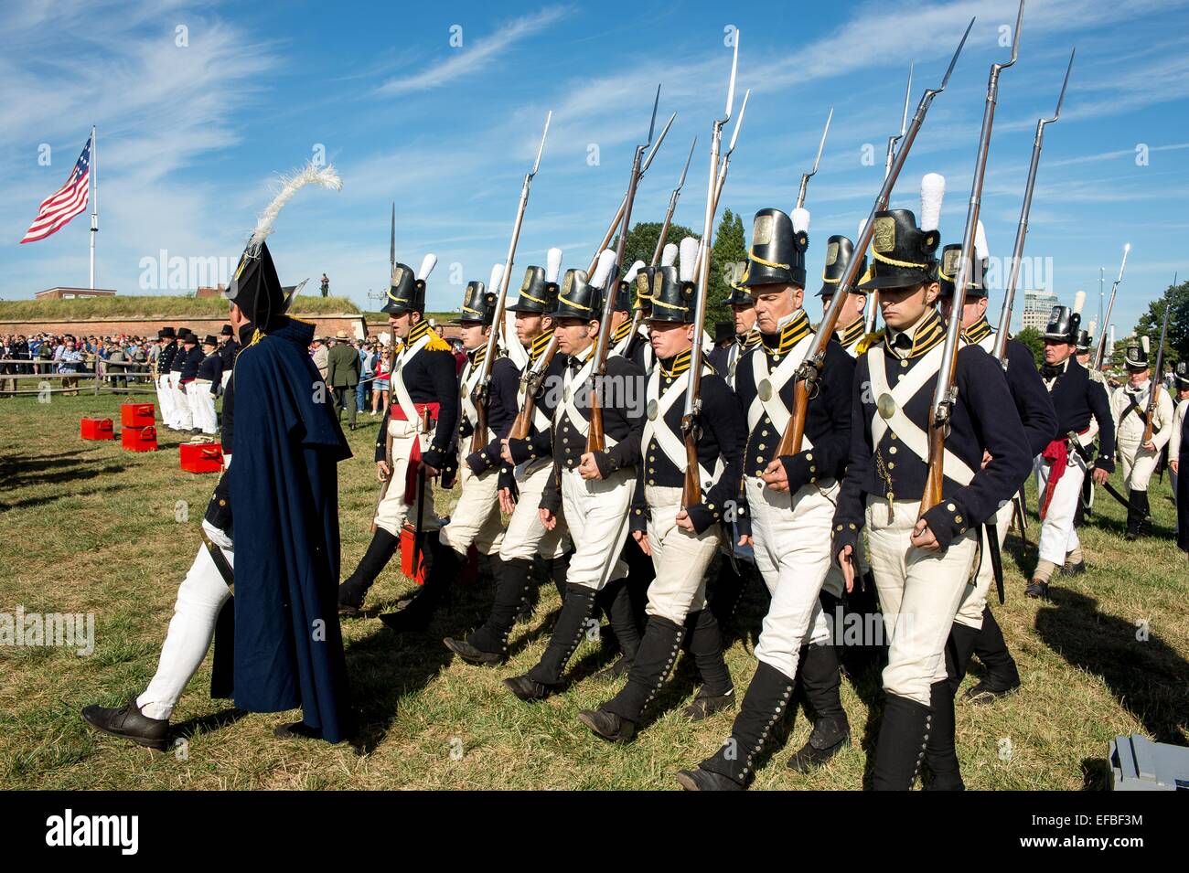 Re-enactors wearing period costumes parade in Fort McHenry during the ...