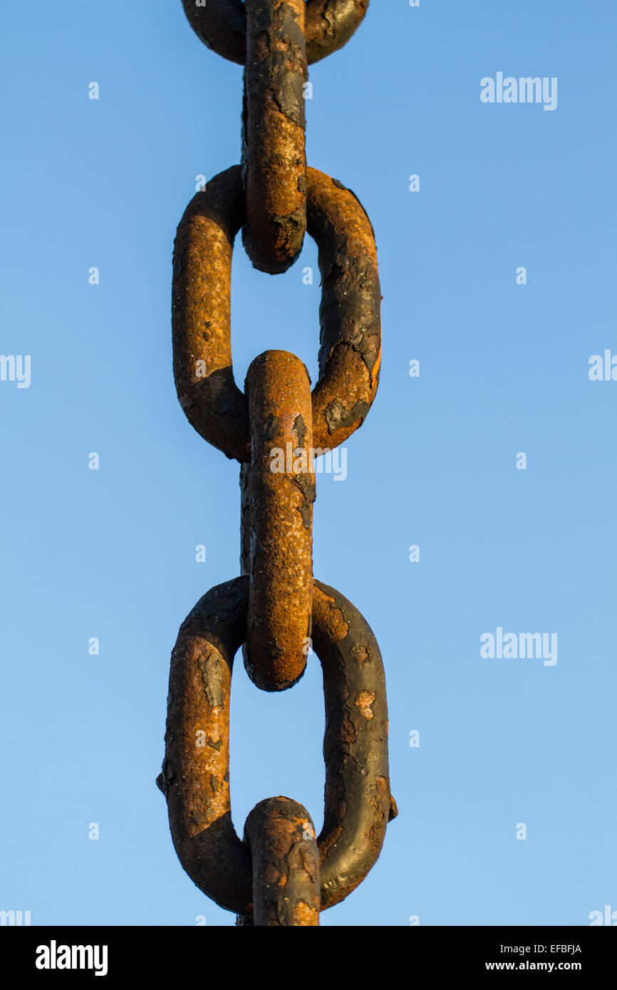 thick rusty chain on a blue sky background Stock Photo - Alamy