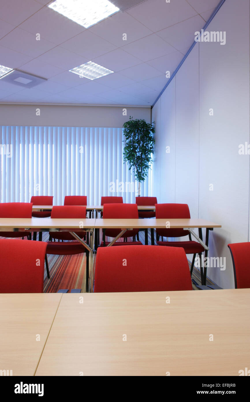 Meeting room with red chairs Stock Photo - Alamy