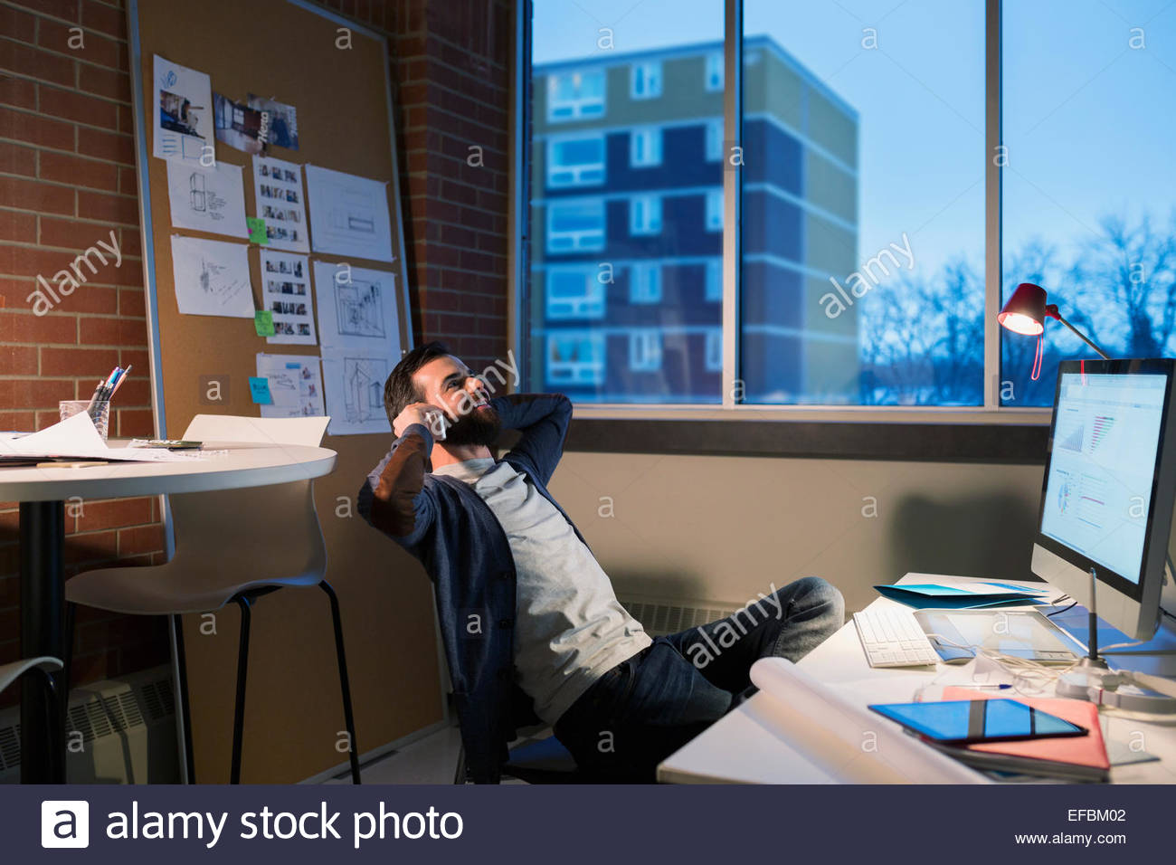 Businessman desk office leaning back hi-res stock photography and ...