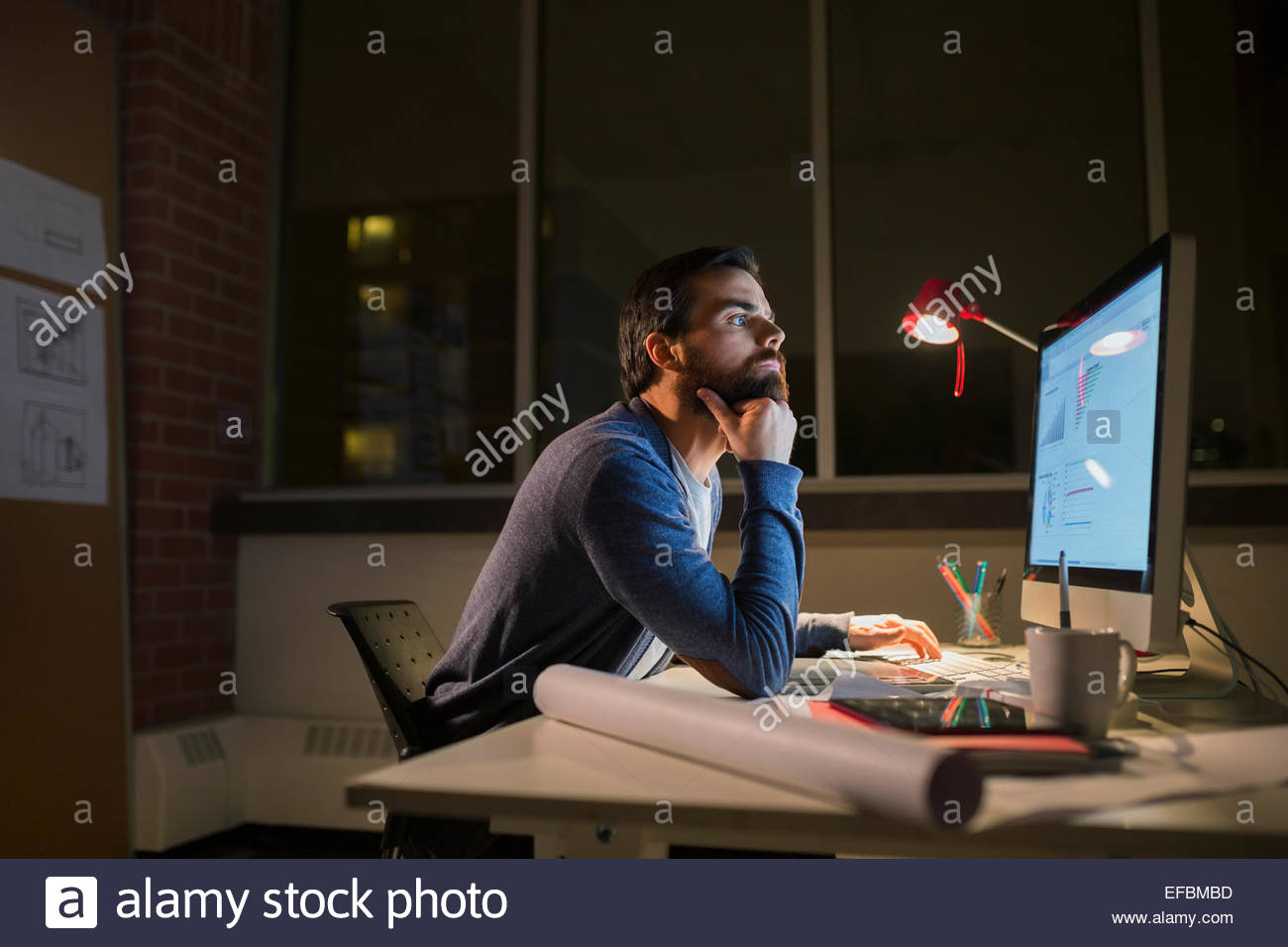 Working late in office hi-res stock photography and images - Alamy