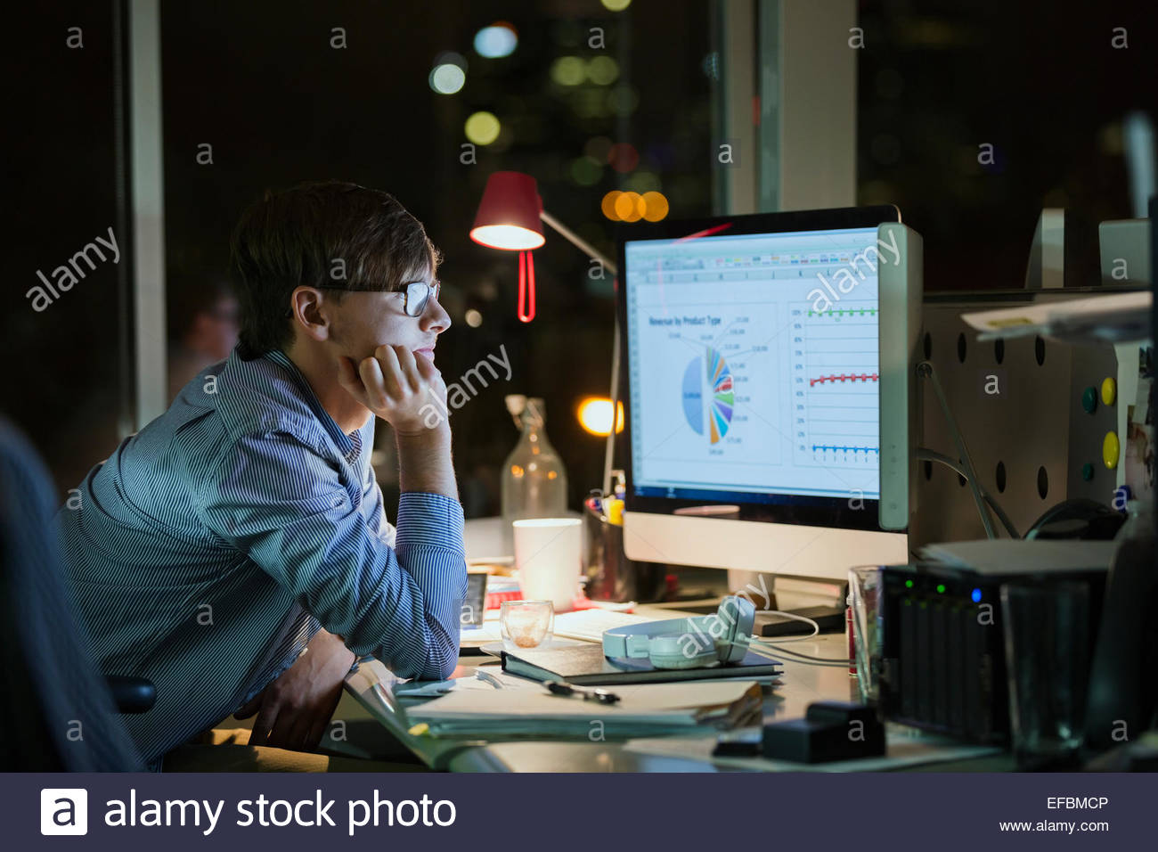 Businessman working at late at computer in office Stock Photo - Alamy