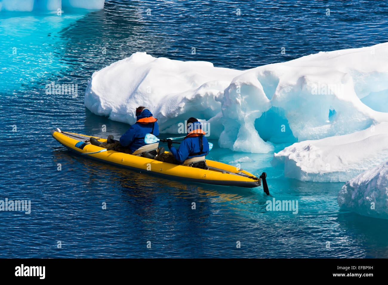Two men in a canoe Stock Photo - Alamy