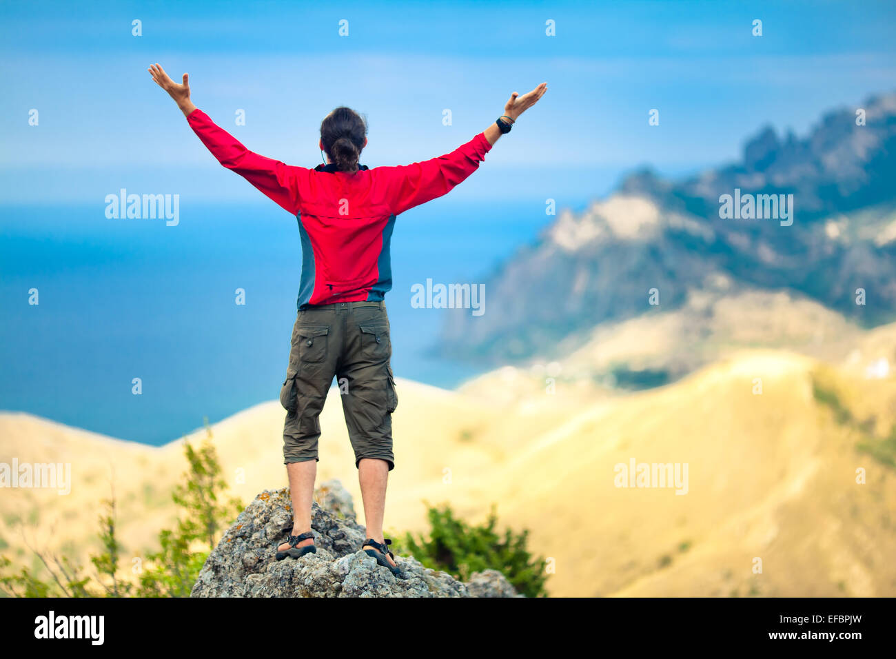 Man on top of mountain Stock Photo - Alamy