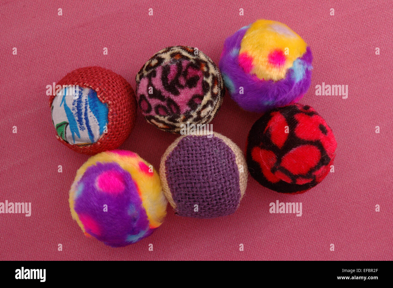 Assortment of cat toys in various colors, patterns and textures, on ...