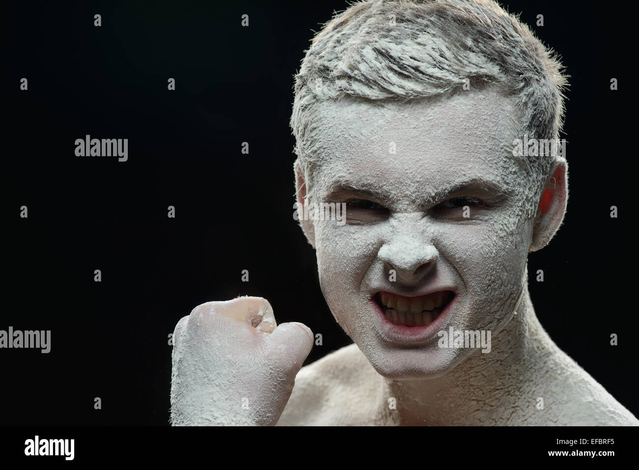 Handsome man with a white powder on the face Stock Photo - Alamy