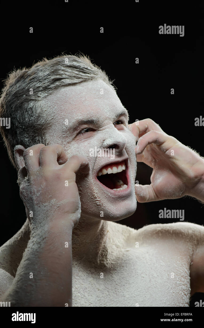 Handsome man covered with powder itching Stock Photo - Alamy