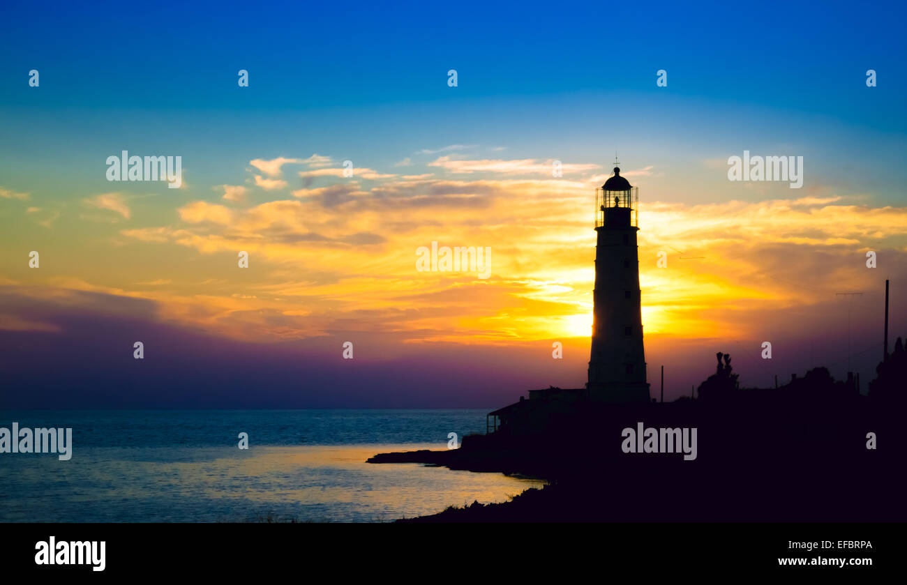 Lighthouse on sunset Stock Photo - Alamy