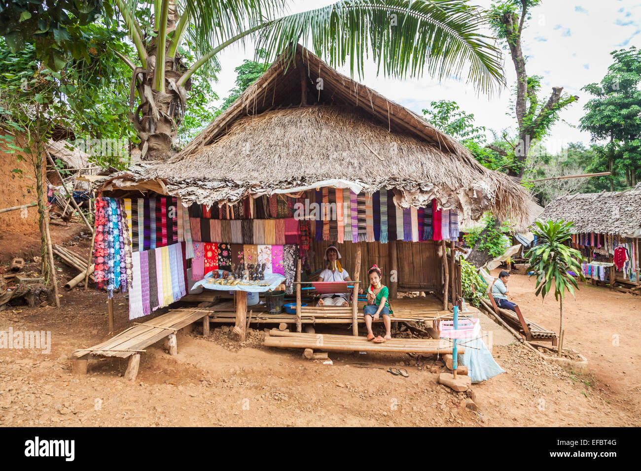 Textile souvenir stall shop run by Burmese long neck woman in Karen ...