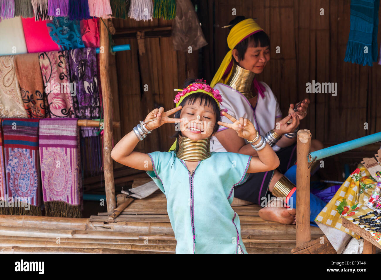 Cute young Burmese long neck girl and sun screen in Karen Padong ...