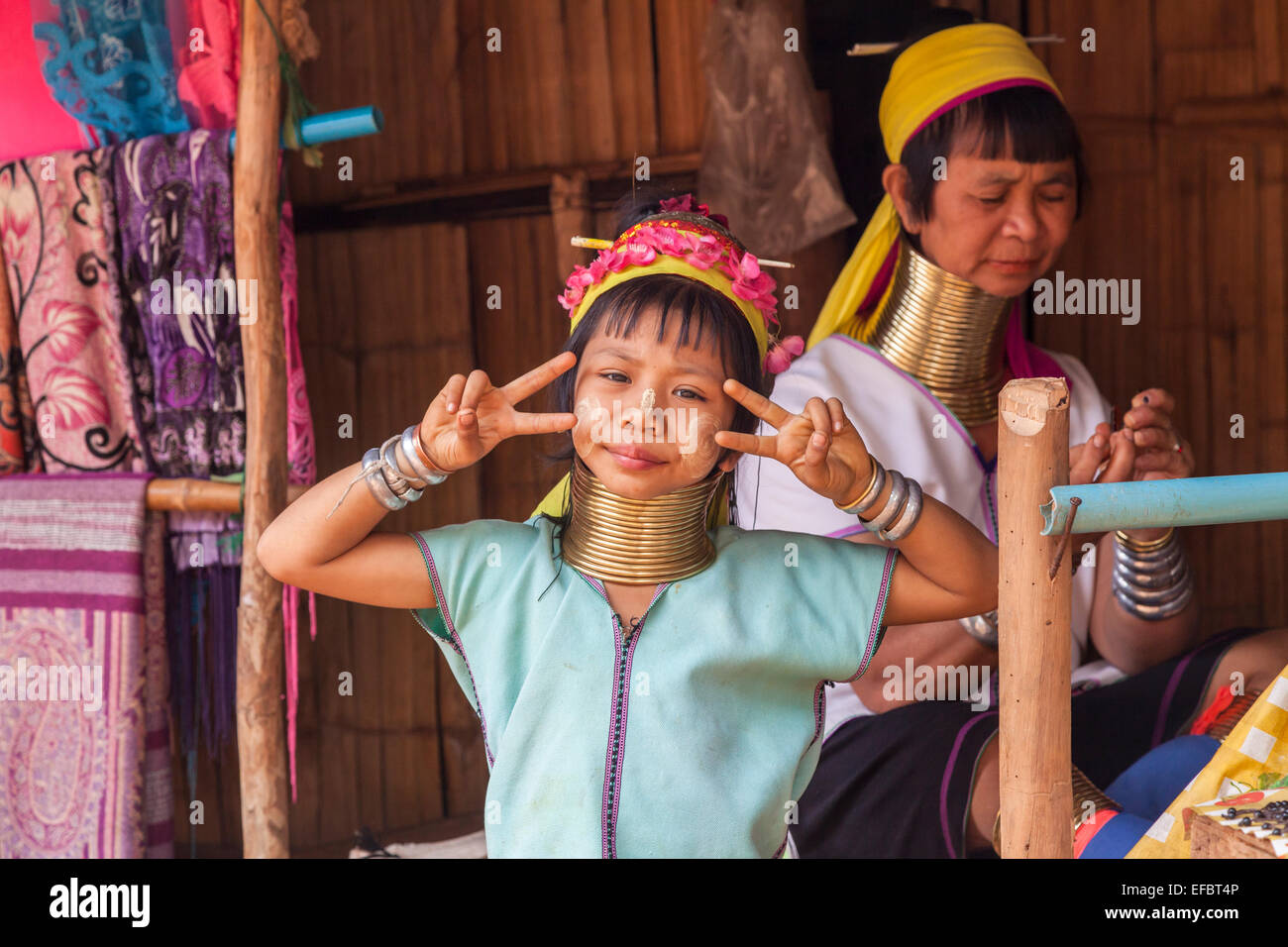 Cute young Burmese long neck girl and sun screen in Karen Padong ...