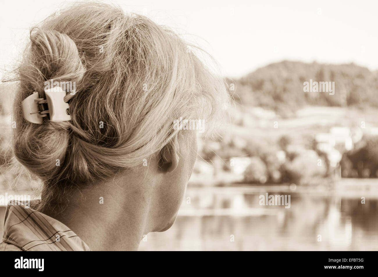 Woman looking at distant landscape Stock Photo - Alamy