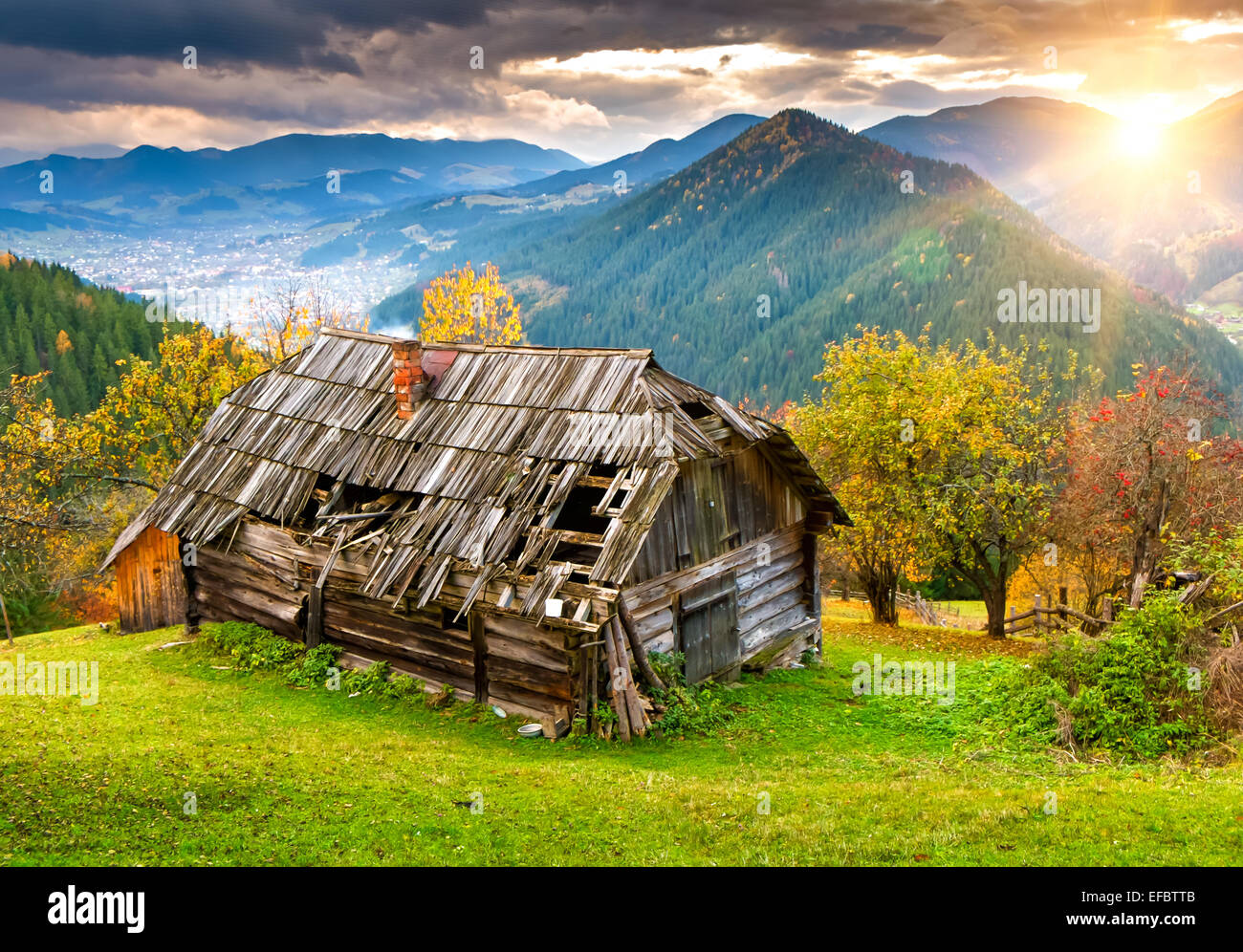 Sunset landscape with old rural house Stock Photo - Alamy