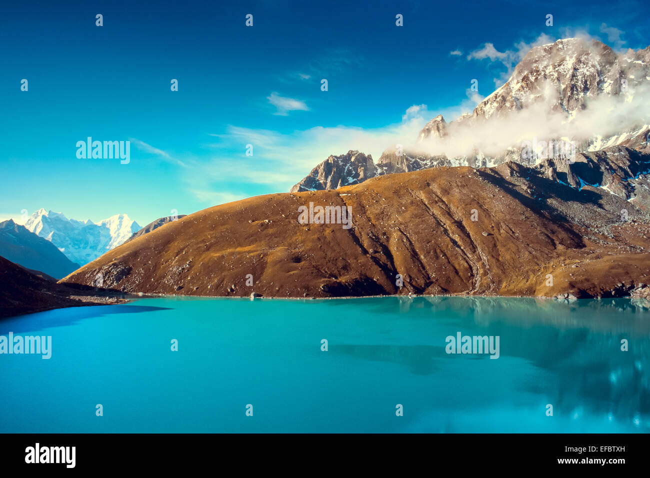 Beautiful snow-capped mountains with lake Stock Photo - Alamy