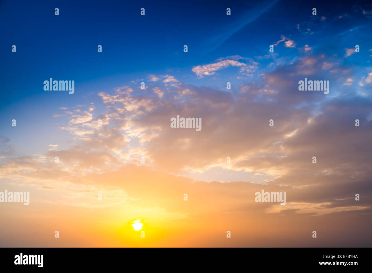 Sunset. blue sky and clouds Stock Photo - Alamy