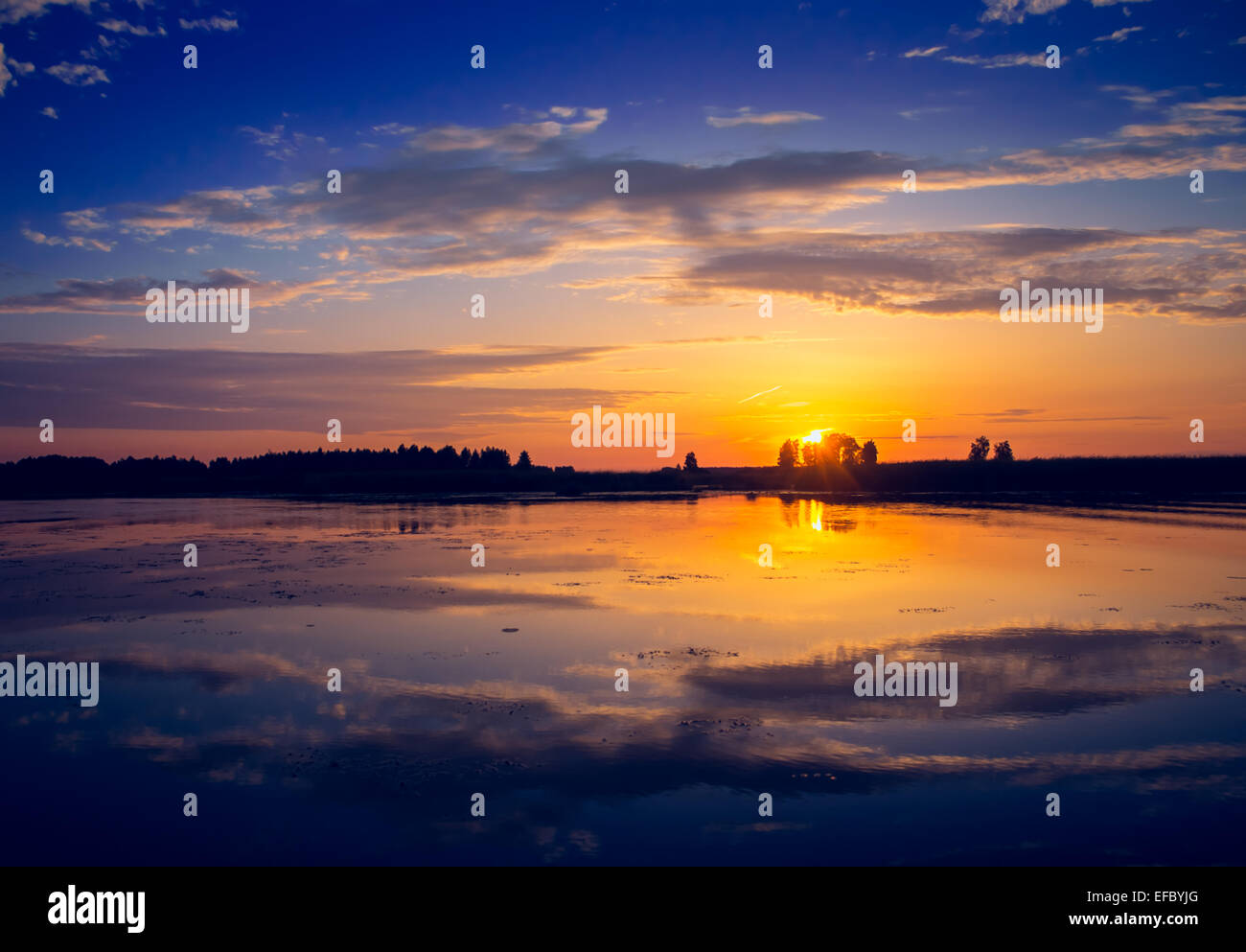 Amazing sunset over lake Stock Photo - Alamy