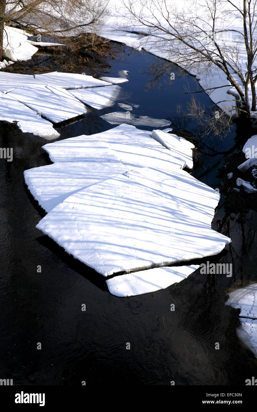 breaking white ice covering river on sunny day Stock Photo - Alamy