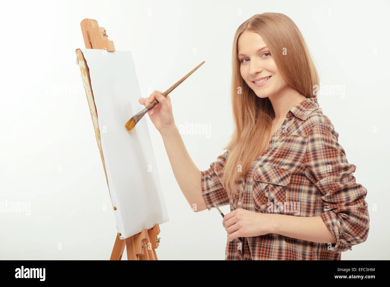 Young beautiful artist creating a masterpiece Stock Photo - Alamy