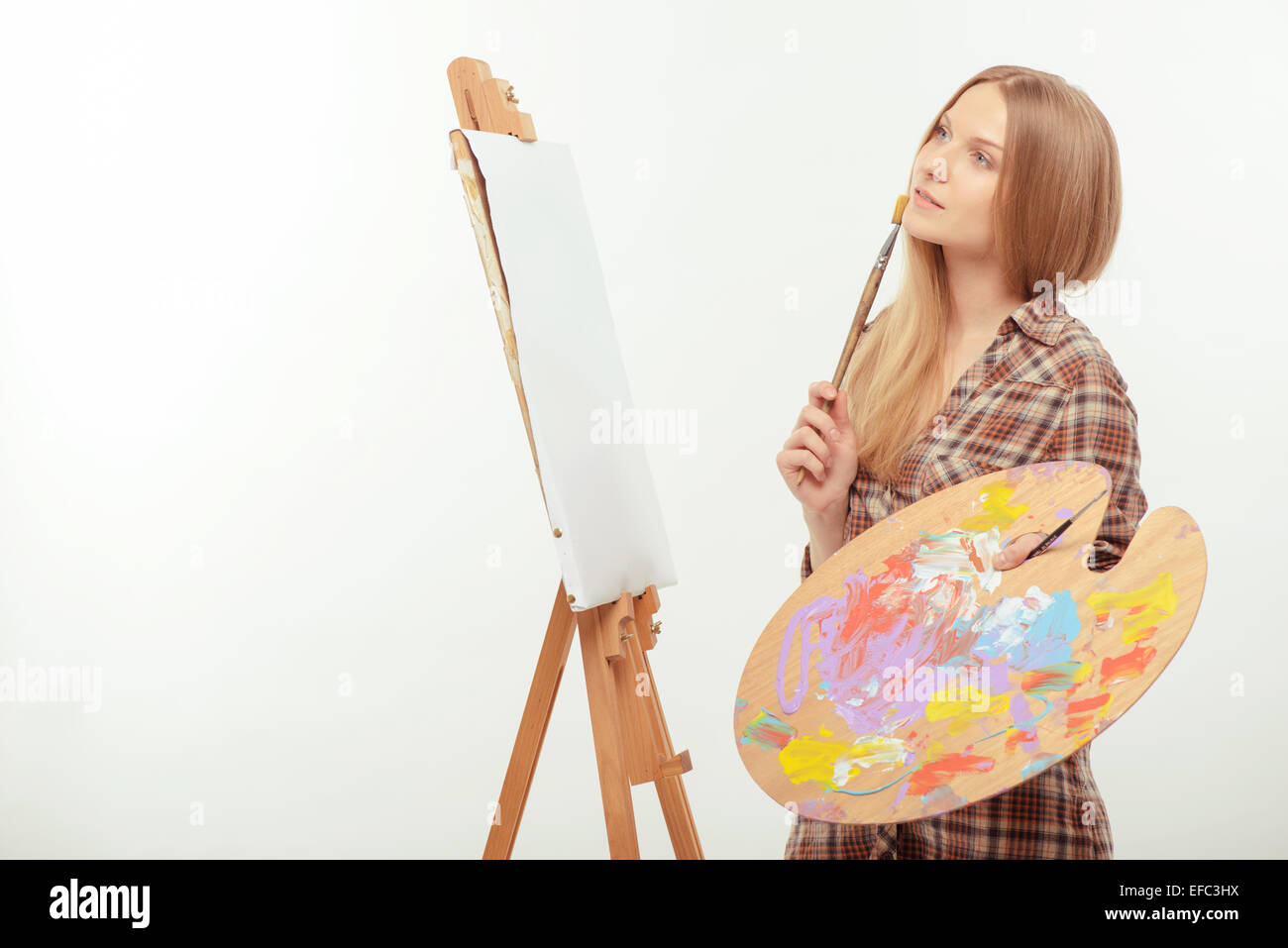 Young beautiful artist creating a masterpiece Stock Photo - Alamy