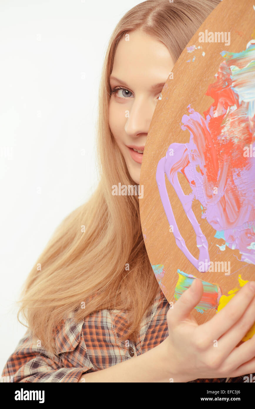 Young beautiful artist posing with a palette Stock Photo - Alamy