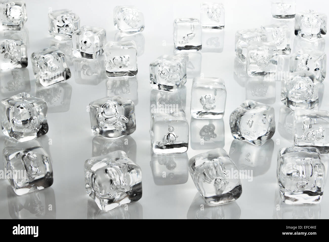Ice cubes arranged on a white background Stock Photo - Alamy