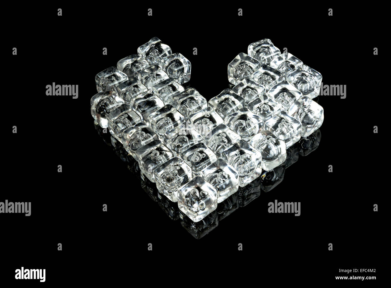 Ice cubes arranged on a black background Stock Photo - Alamy