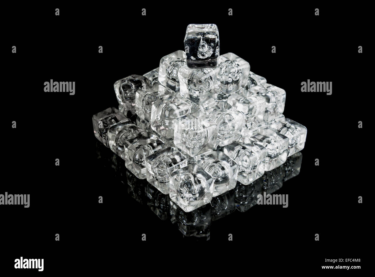 Ice cubes arranged on a black background Stock Photo - Alamy