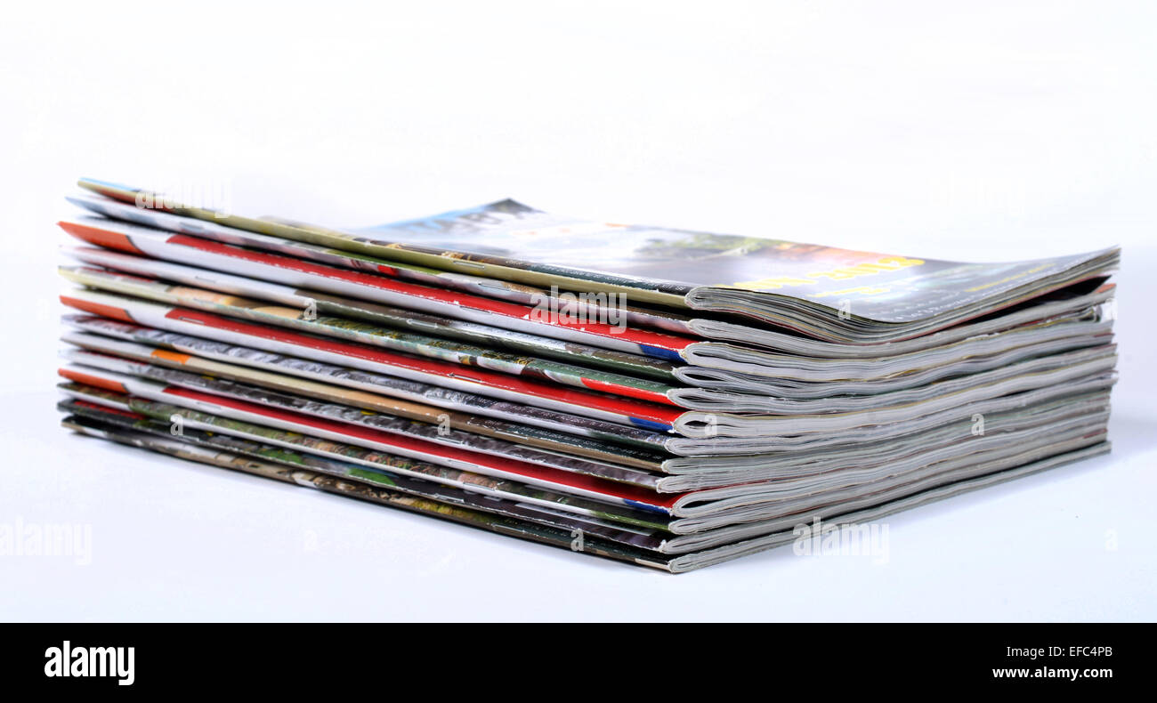 stack of newspapers used on the withe background Stock Photo - Alamy