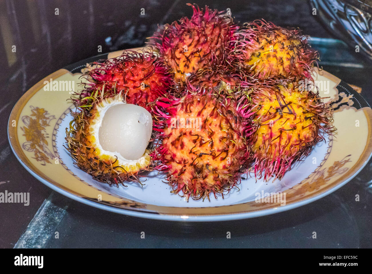 A plate of spiky rambutan fruits Stock Photo - Alamy