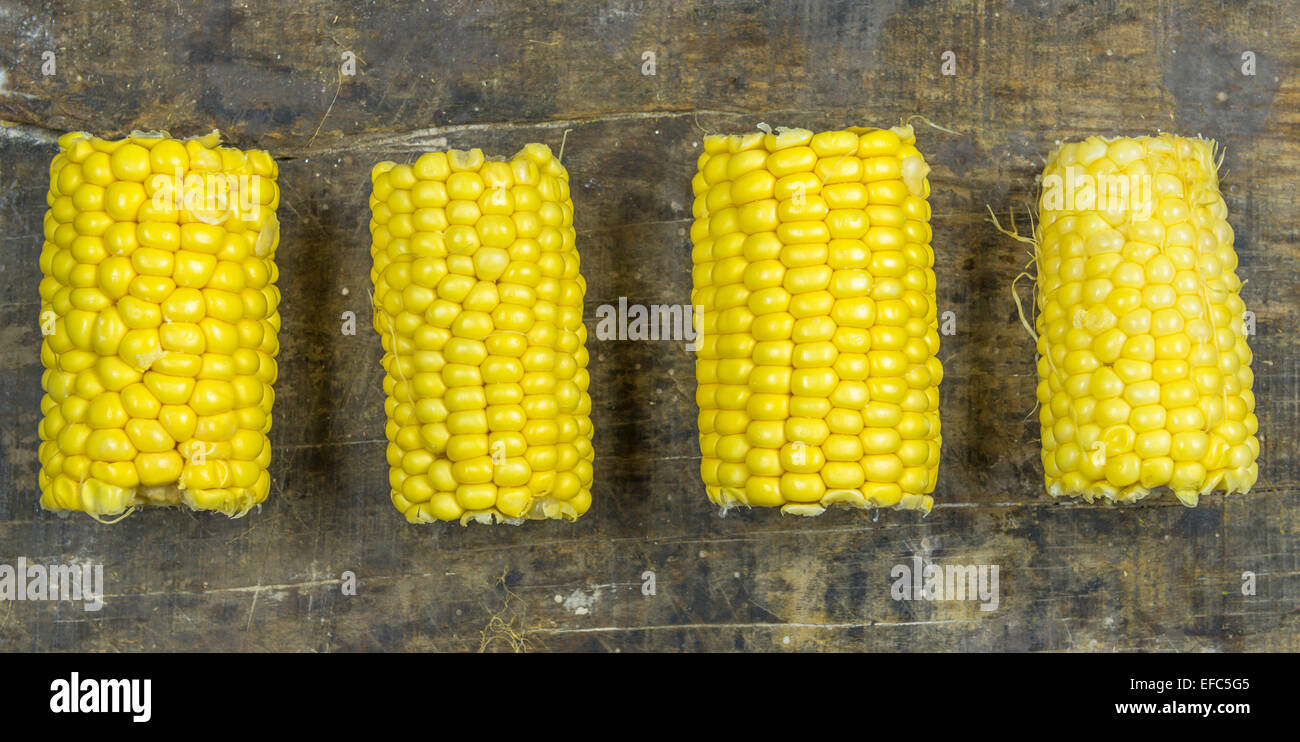 Fresh sweetcorn on old rustic wooden table Stock Photo - Alamy