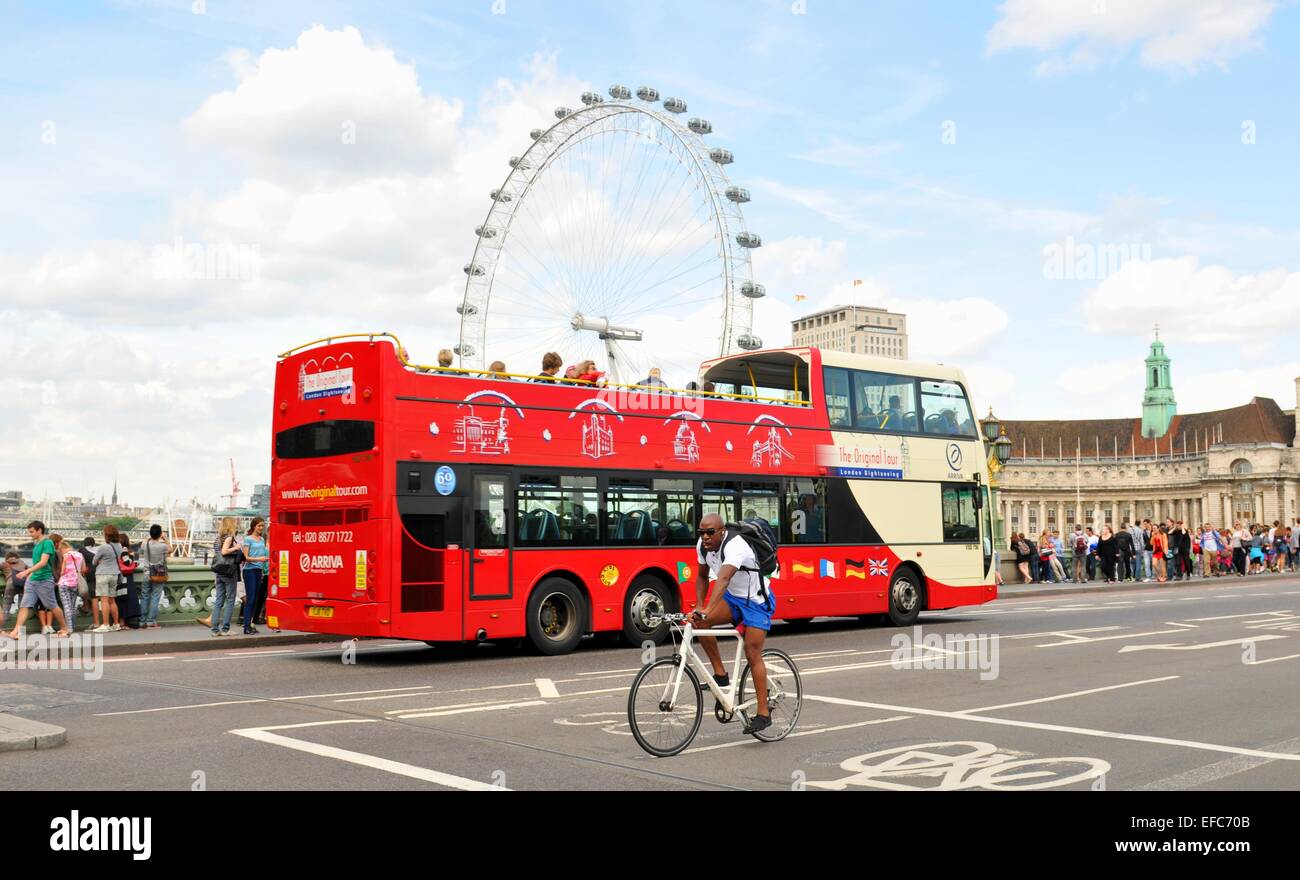 LONDON, UK - JULY 9, 2014: Modern double-decker red bus crosses the ...