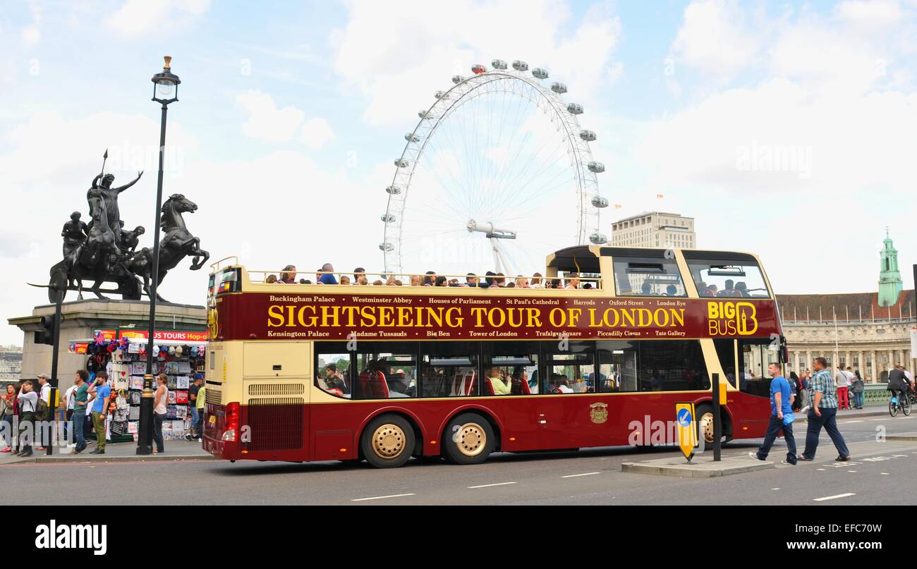 LONDON, UK - JULY 9, 2014: Modern double-decker red bus crosses the ...