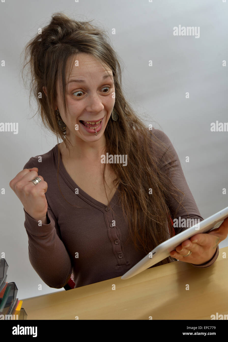 A young lady with a computer on white background Stock Photo - Alamy