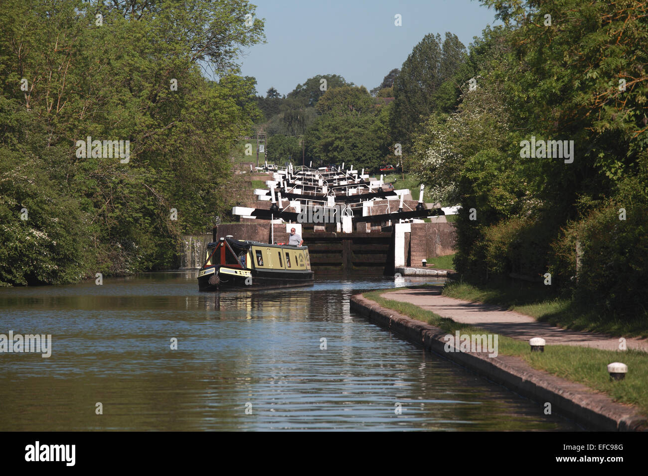 A narrowboat leaving Lock 37 of the Hatton flight of locks on the Grand ...