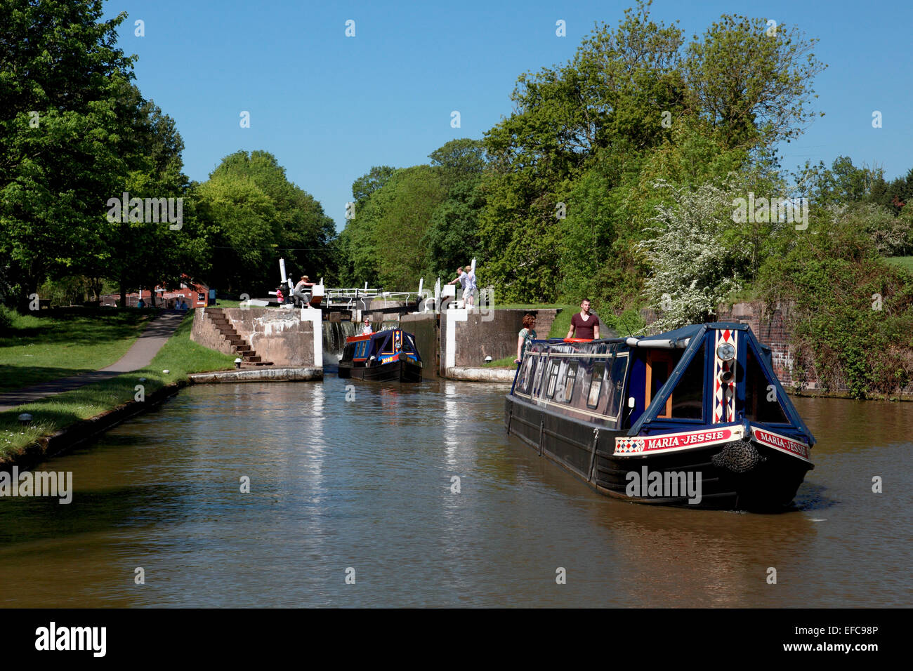 Narrowboats leaving Lock 44 of the Hatton flight of locks on the Grand ...