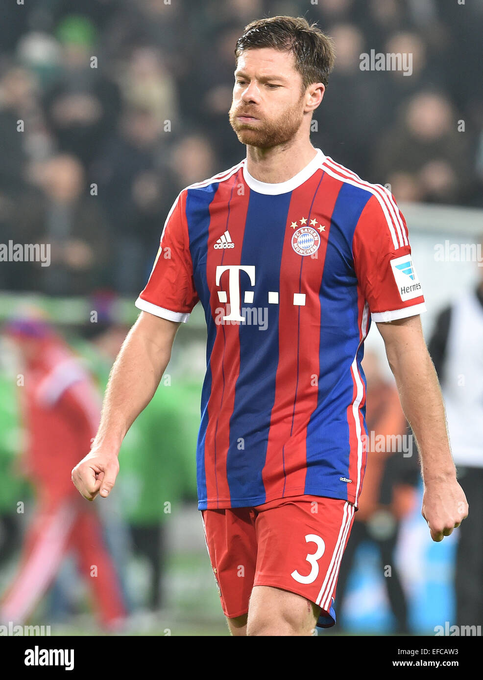 Wolfsburg, Germany. 30th Jan, 2015. Munich's Xabi Alonso reacts after ...