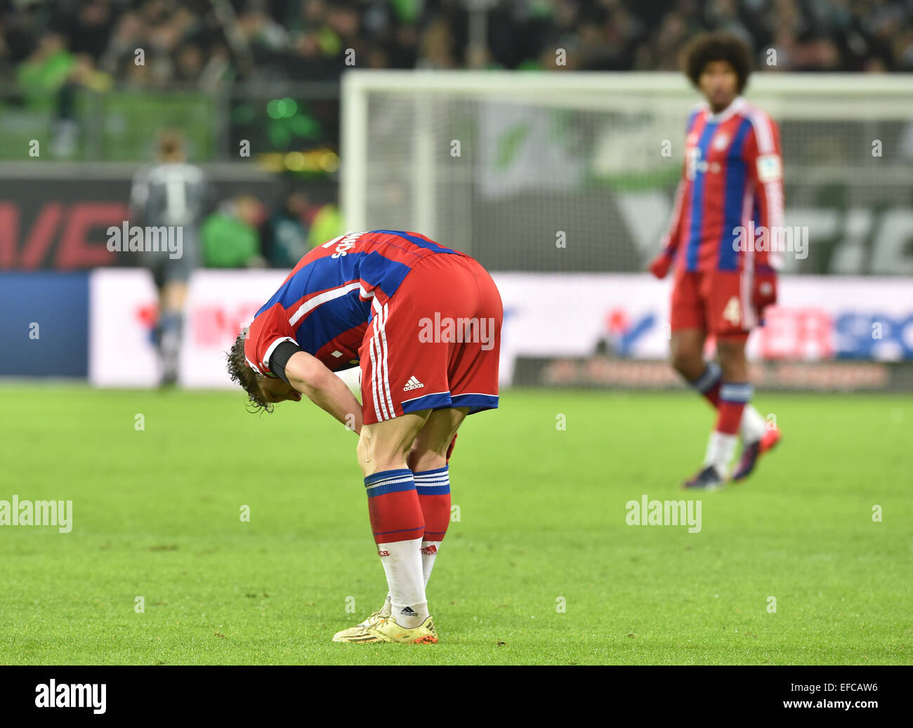Wolfsburg, Germany. 30th Jan, 2015. Munich's Bastian Schweinsteiger and ...