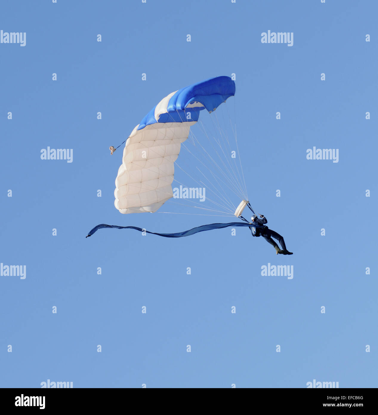 Sky diver floating with a rectangular parachute Stock Photo - Alamy