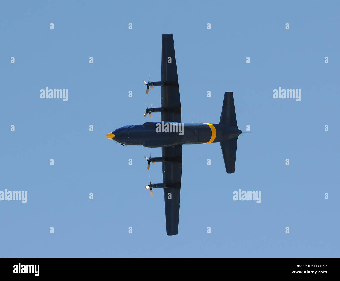 Modern propeller cargo airplane flying overhead Stock Photo - Alamy