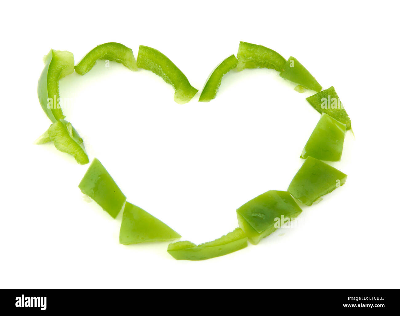 Heart shape formed with chopped green pepper on white background Stock ...