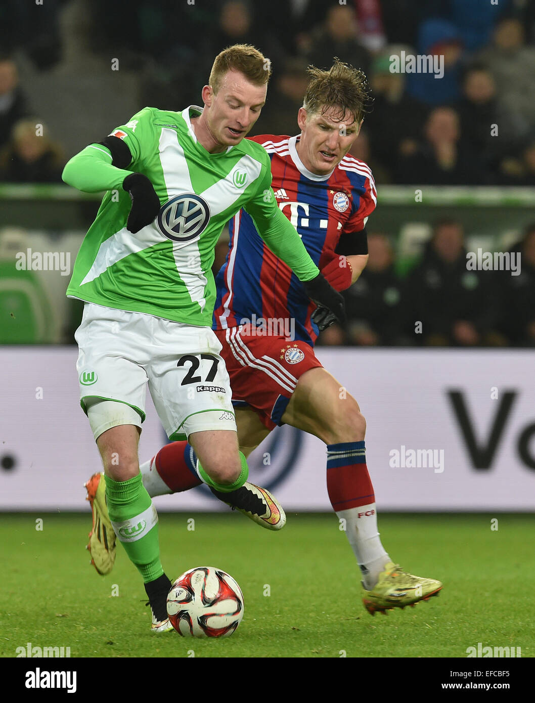 Wolfsburg, Germany. 30th Jan, 2015. Munich's Bastian Schweinsteiger (R ...