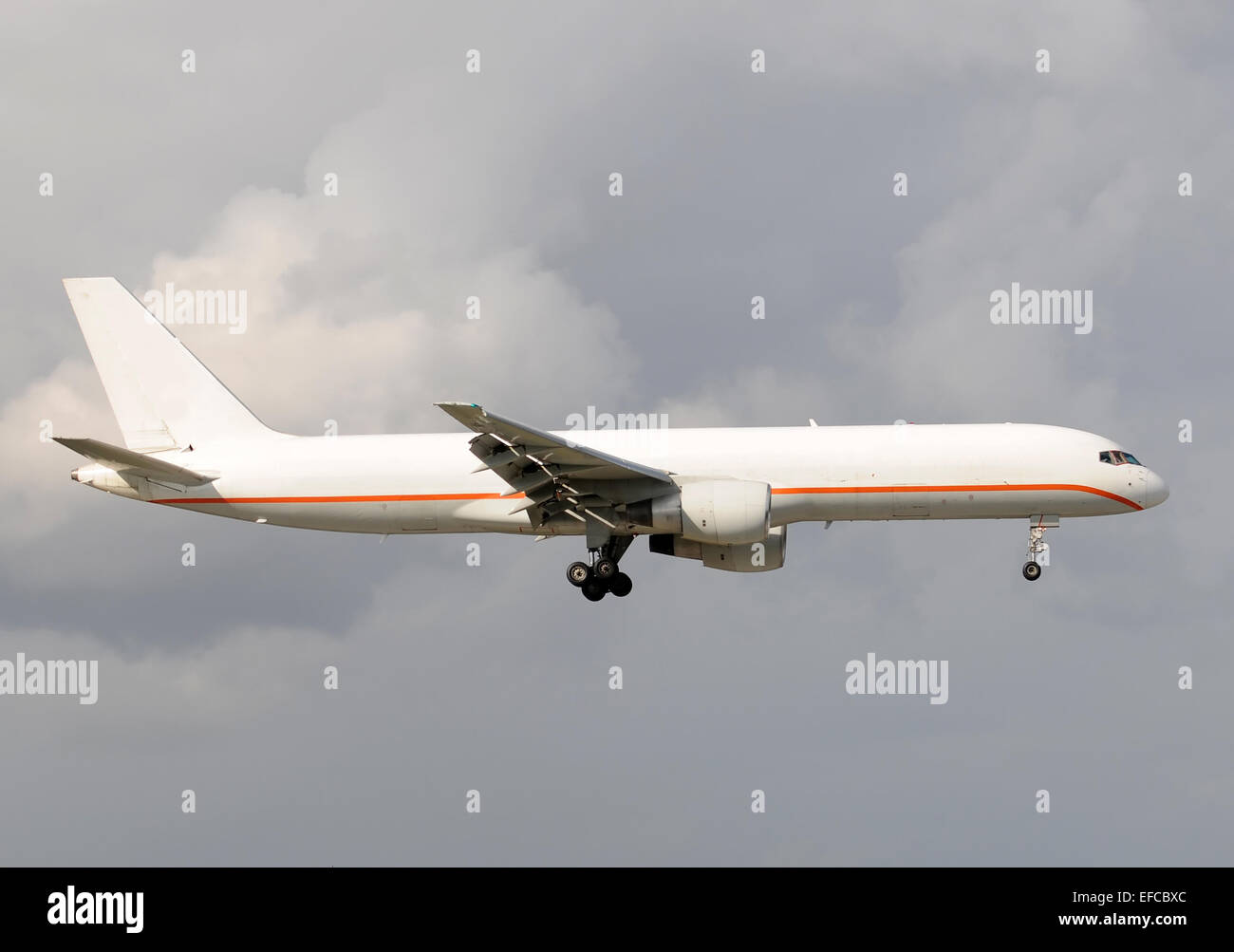Modern cargo jet airplane painted white side view Stock Photo - Alamy