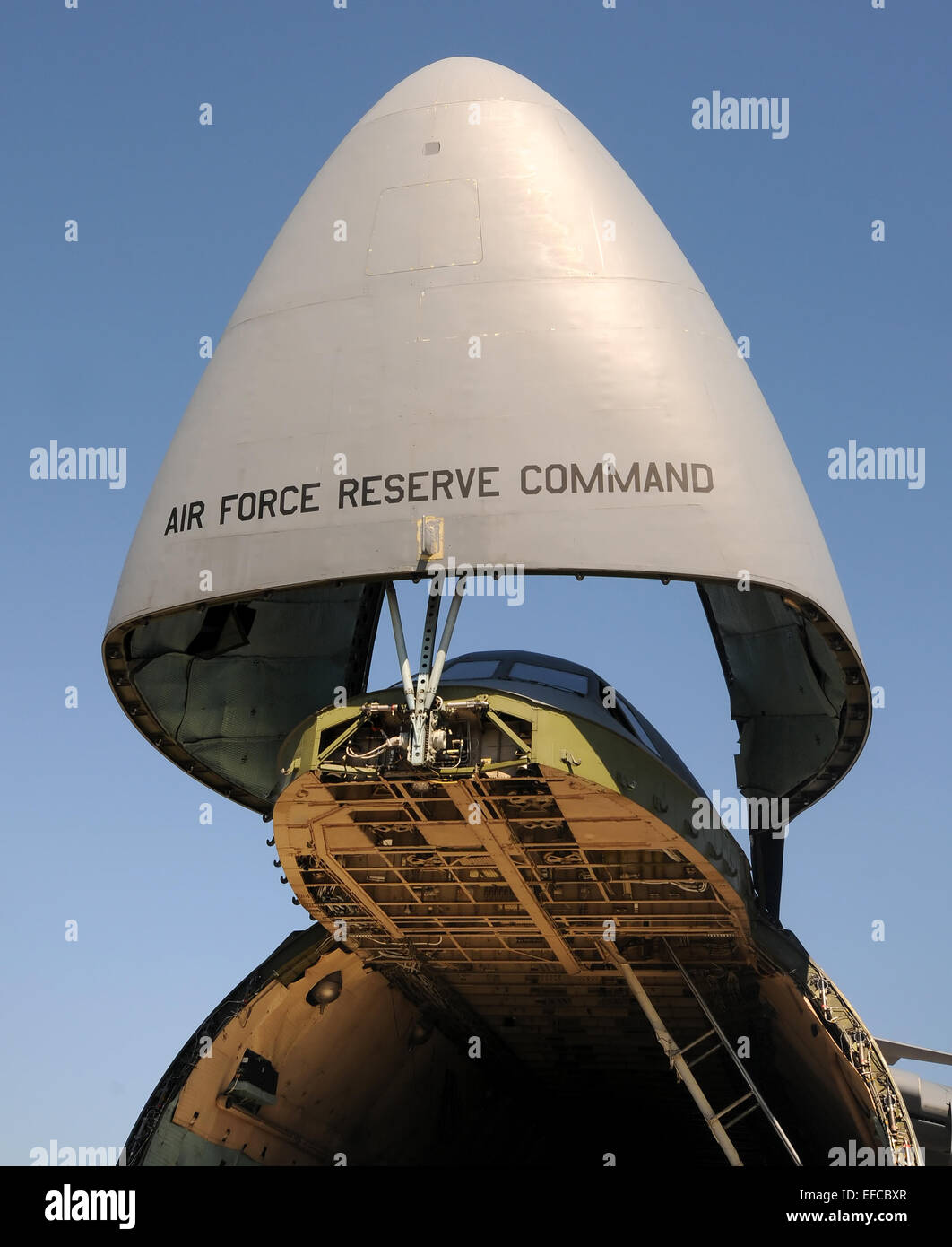 Giant military transport jet with open nose for cargo Stock Photo - Alamy