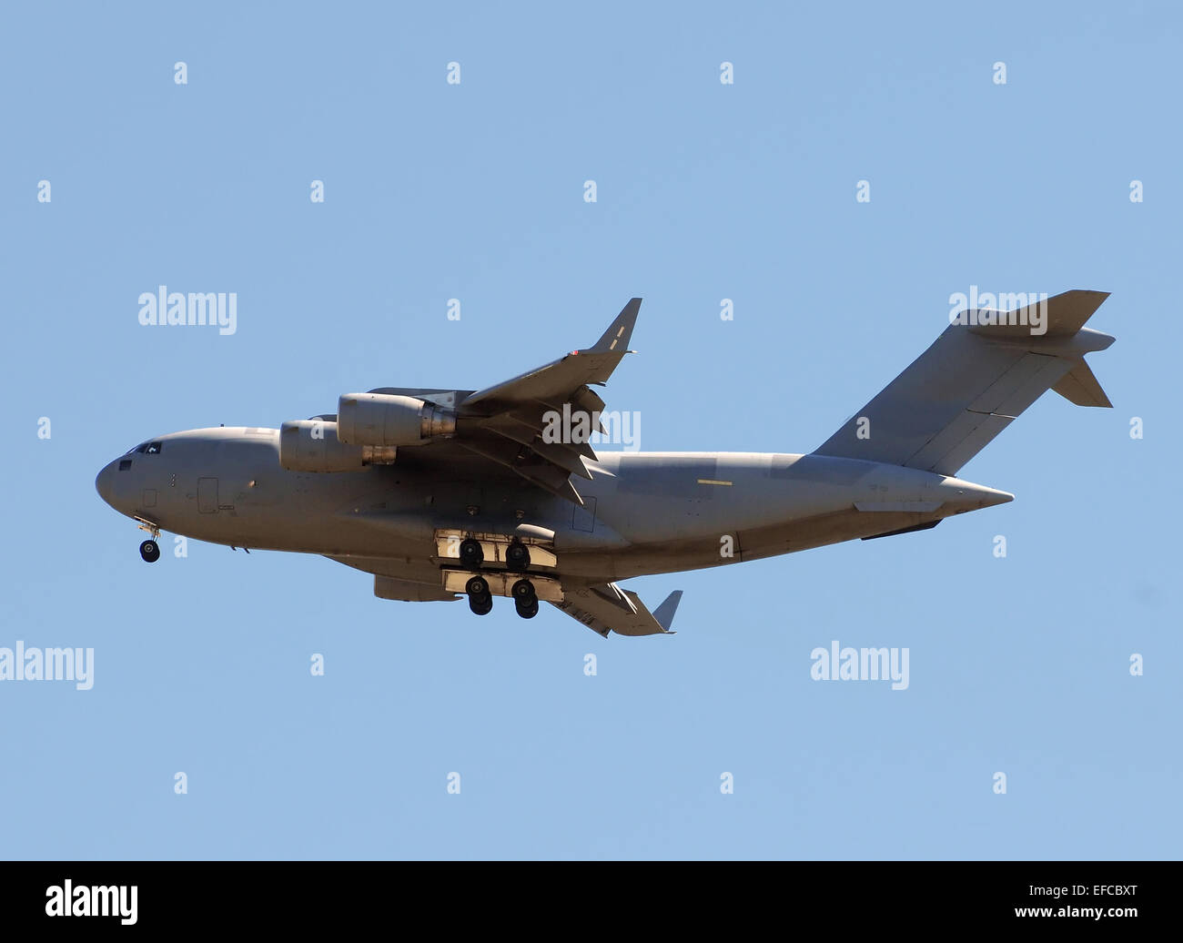 Heavy military cargo jet in flight Stock Photo - Alamy