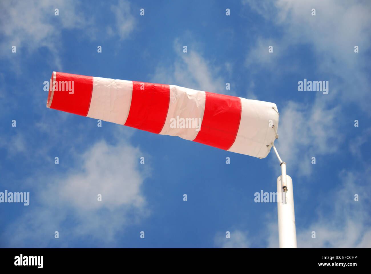 Windsock against blue sky Stock Photo - Alamy