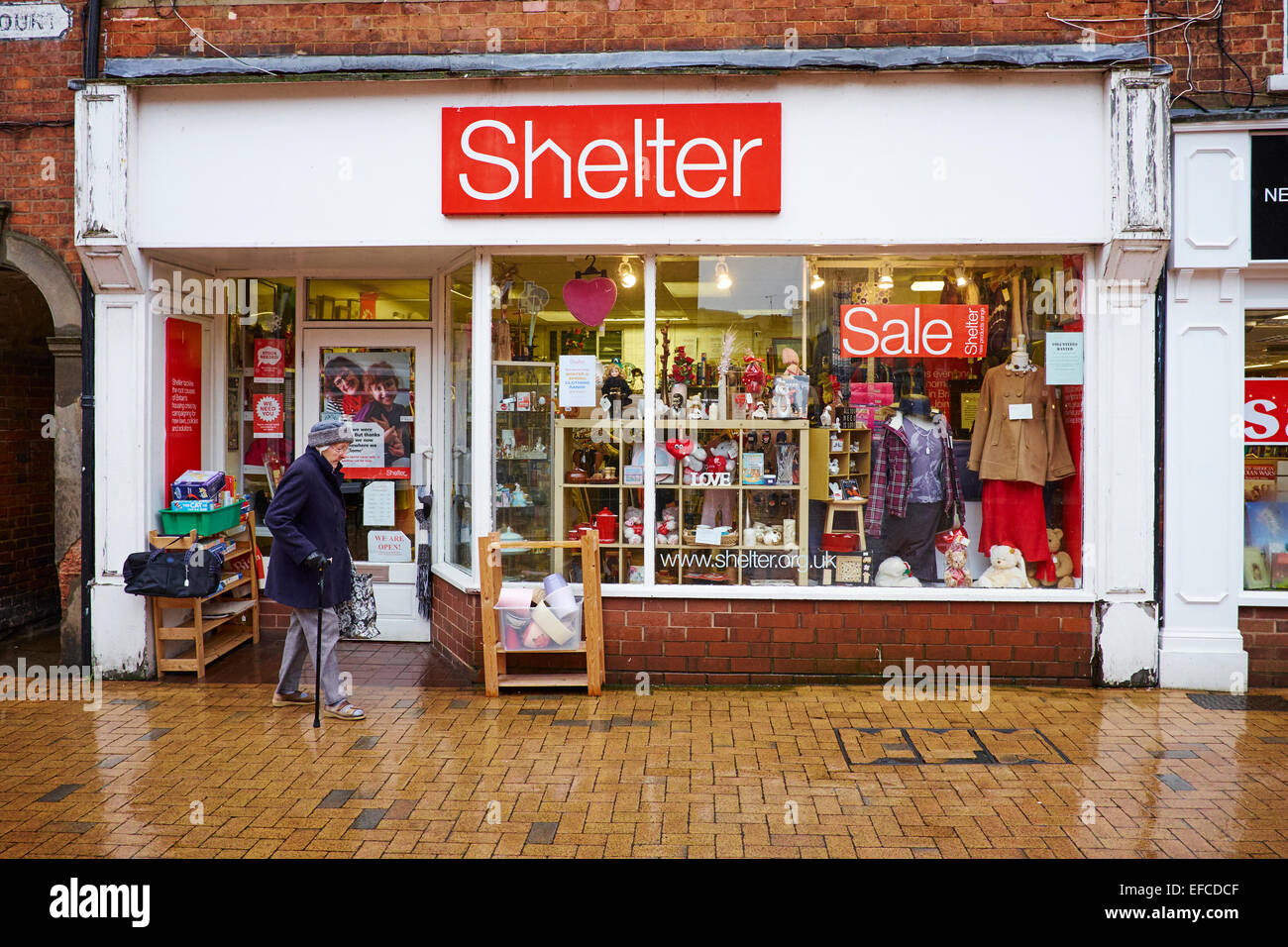 Elderly Woman Walking Past The Shelter Charity Shop High Street Rugby ...