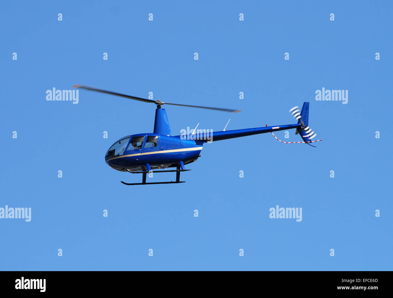 Small private helicopter flying by Stock Photo - Alamy