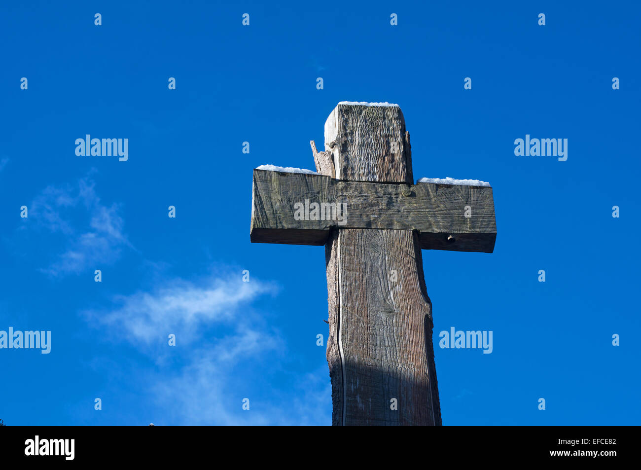 Rough wooden cross against a deep blue sky, Durham, north east England ...