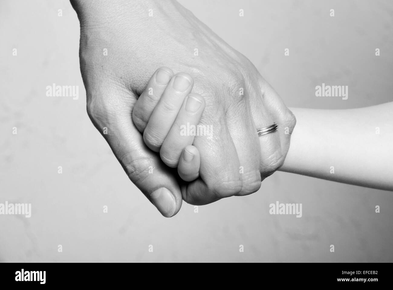 Hand together love family sign Stock Photo - Alamy