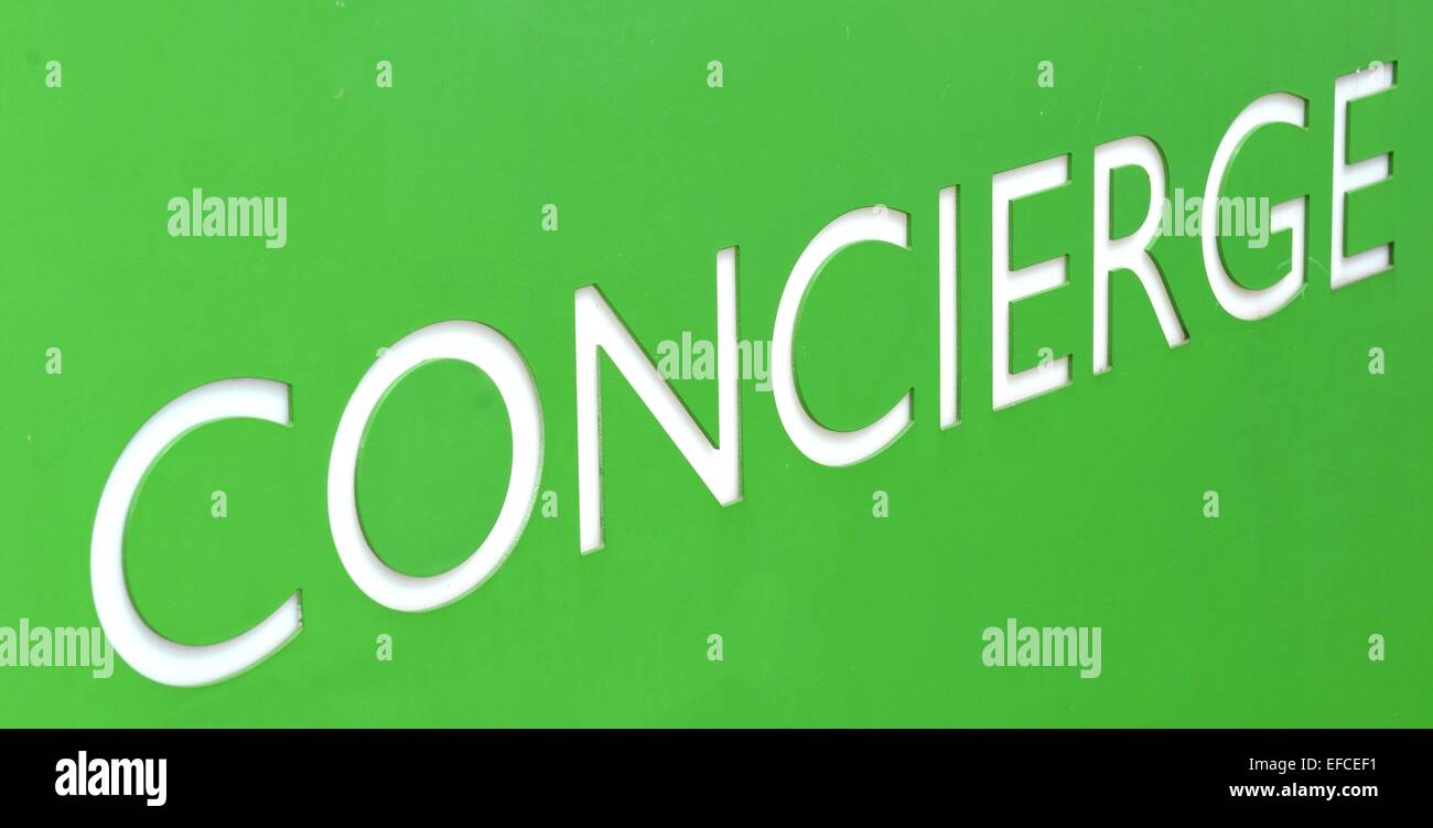 Concierge sign on green background Stock Photo - Alamy